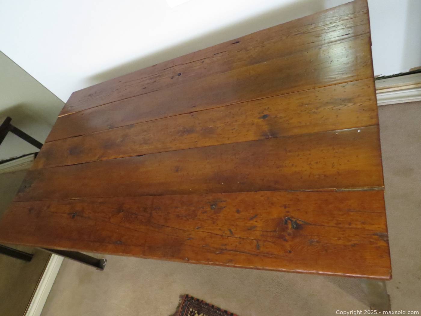 Reclaimed barnboard dining table with metal base | Maxsold