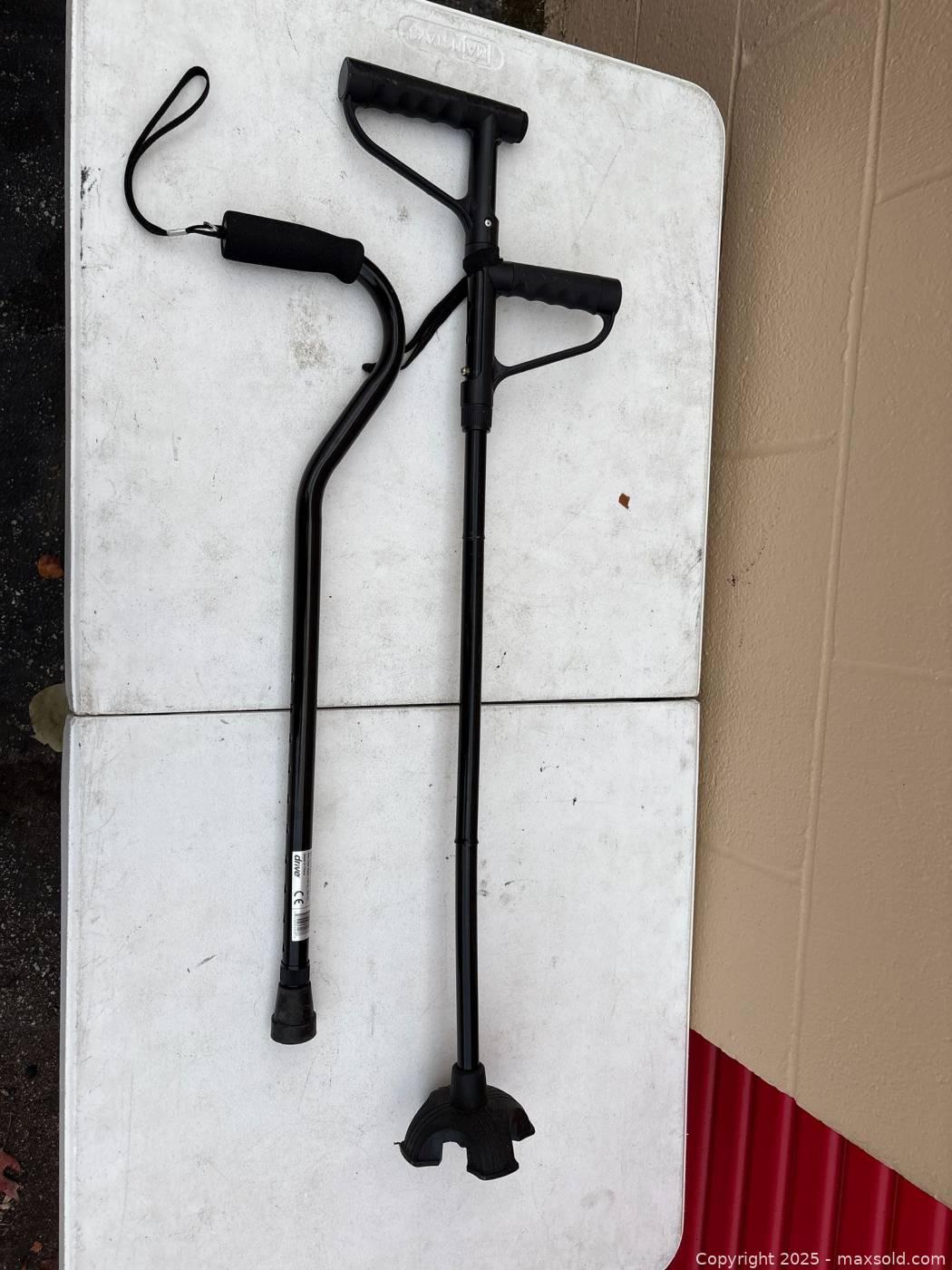 Adjustable black metal canes set of 2 | Maxsold