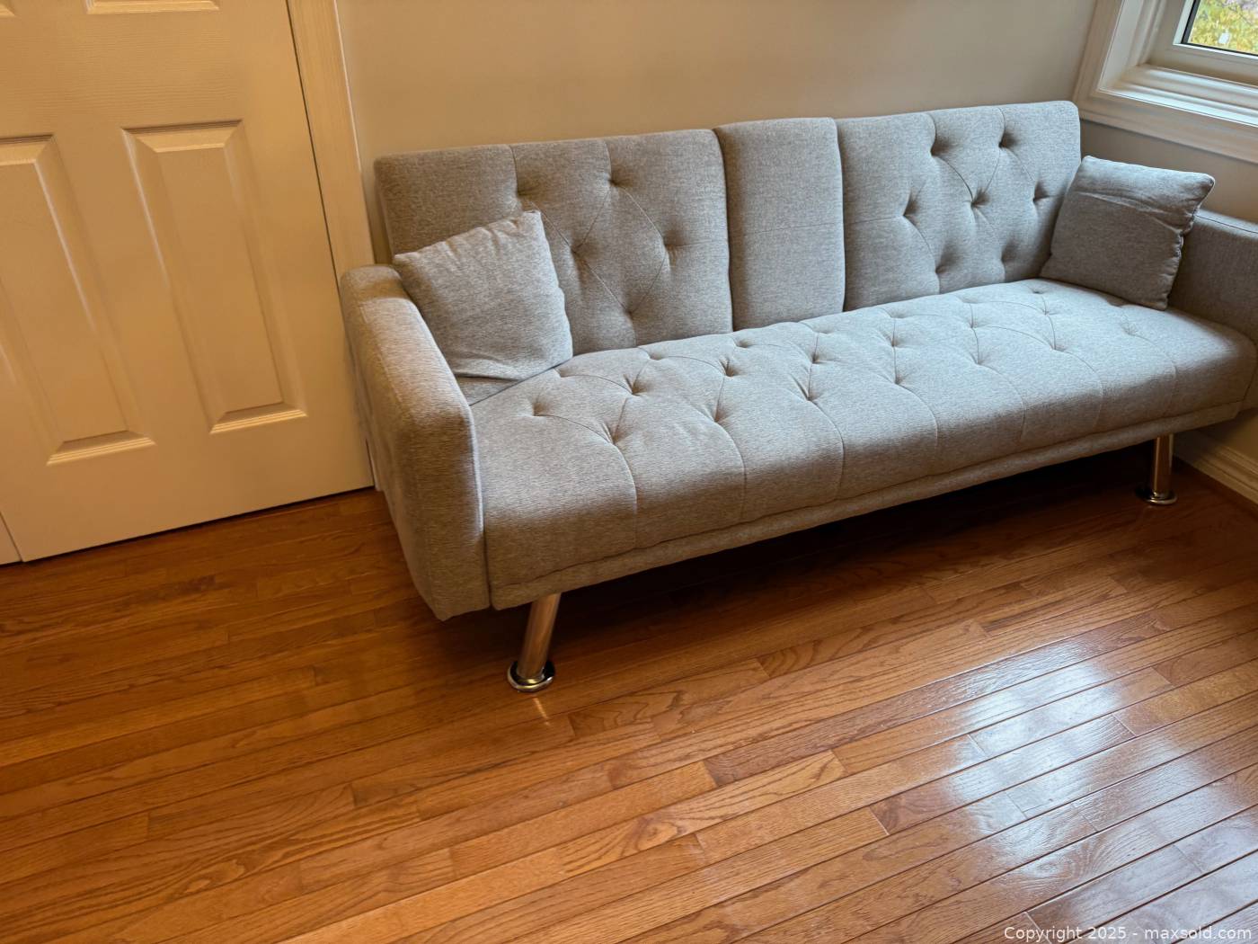 Modern grey tufted convertible futon sofa | Maxsold