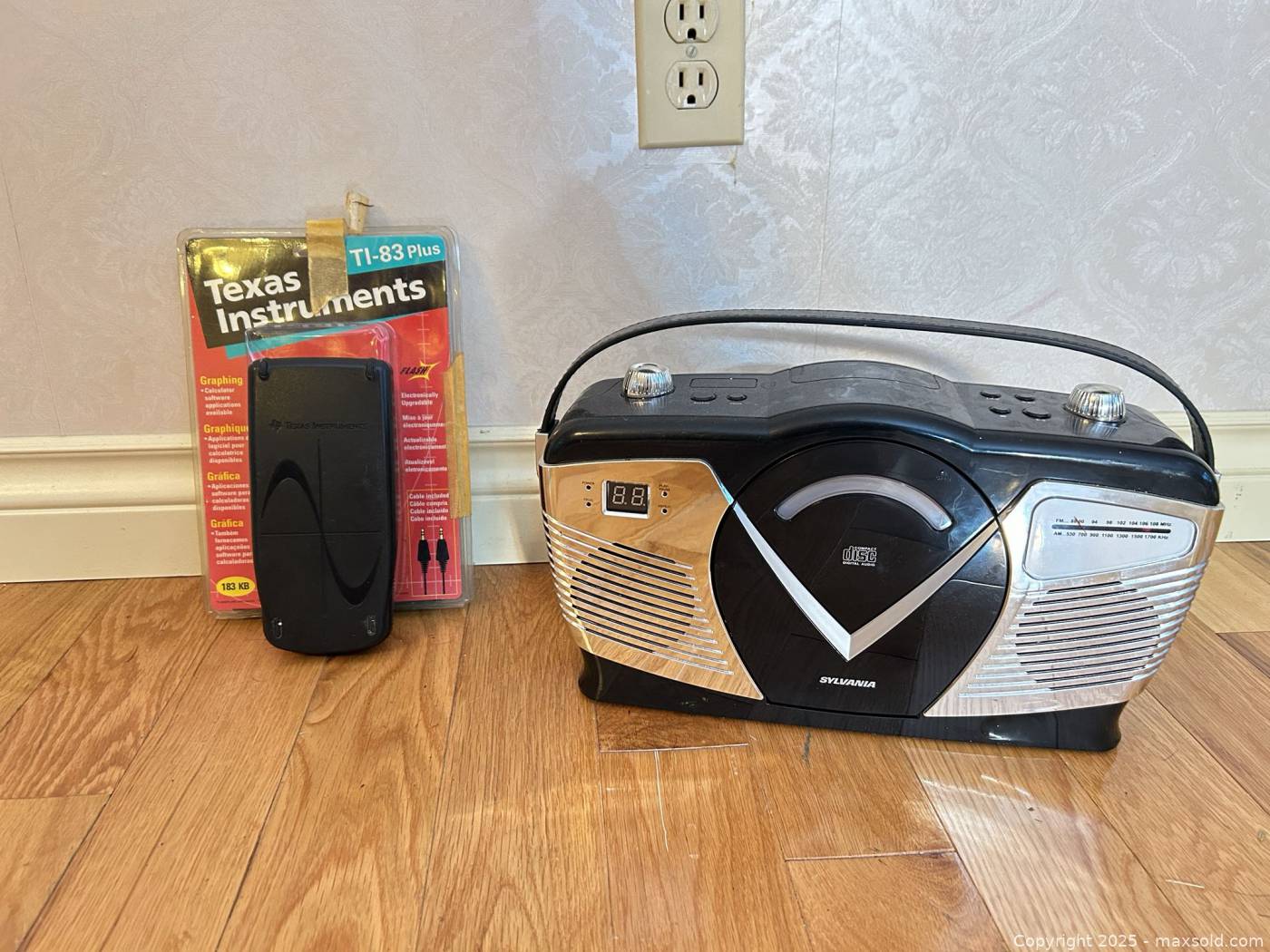 Sylvania boombox and TI-83 Plus calculator | Maxsold