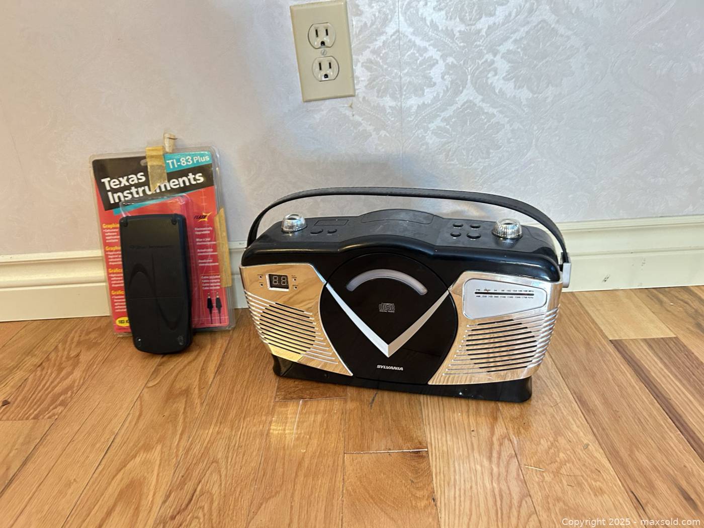 Sylvania boombox and TI-83 Plus calculator | Maxsold