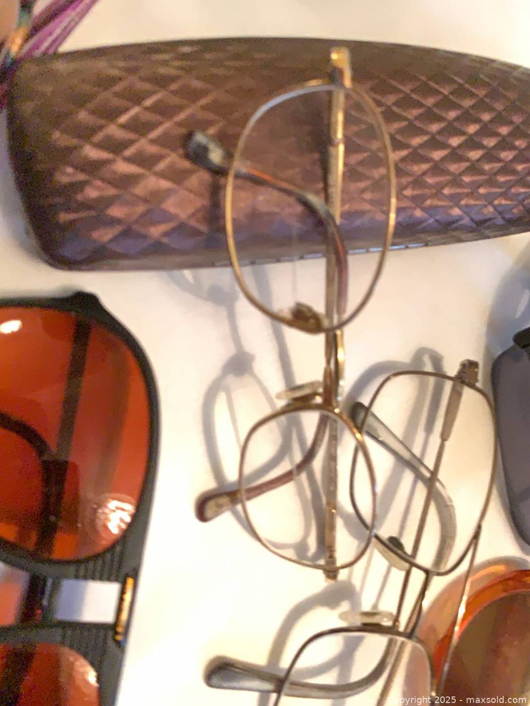 Assorted sunglasses and eyeglasses with cases | Maxsold