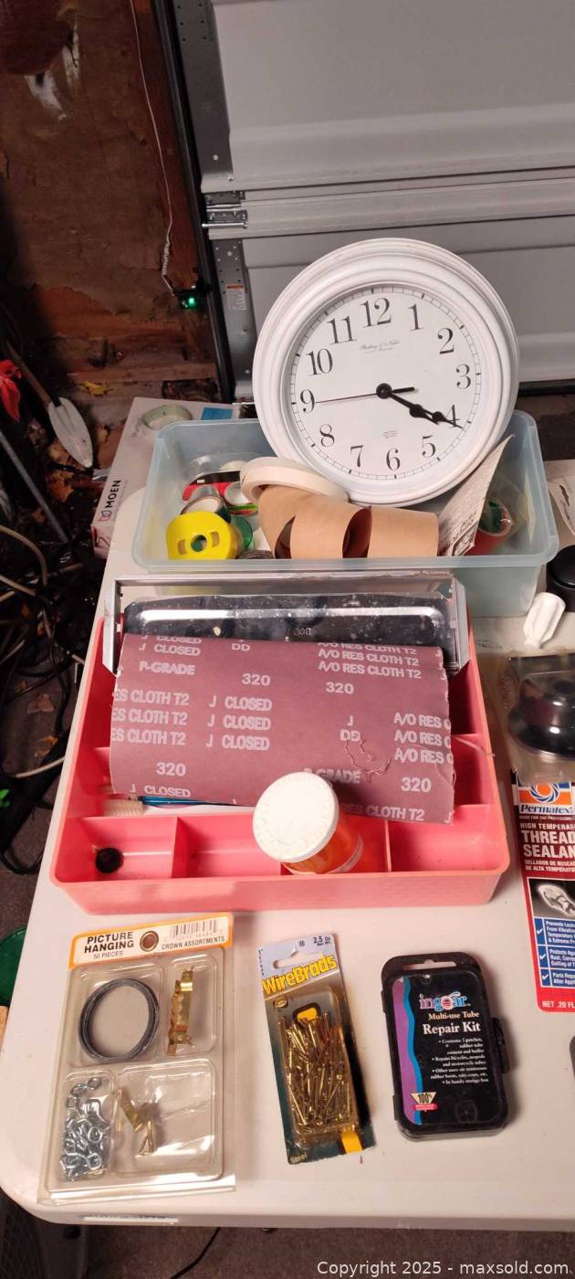 Assorted handyman hardware, clock, joint compound, straps | Maxsold