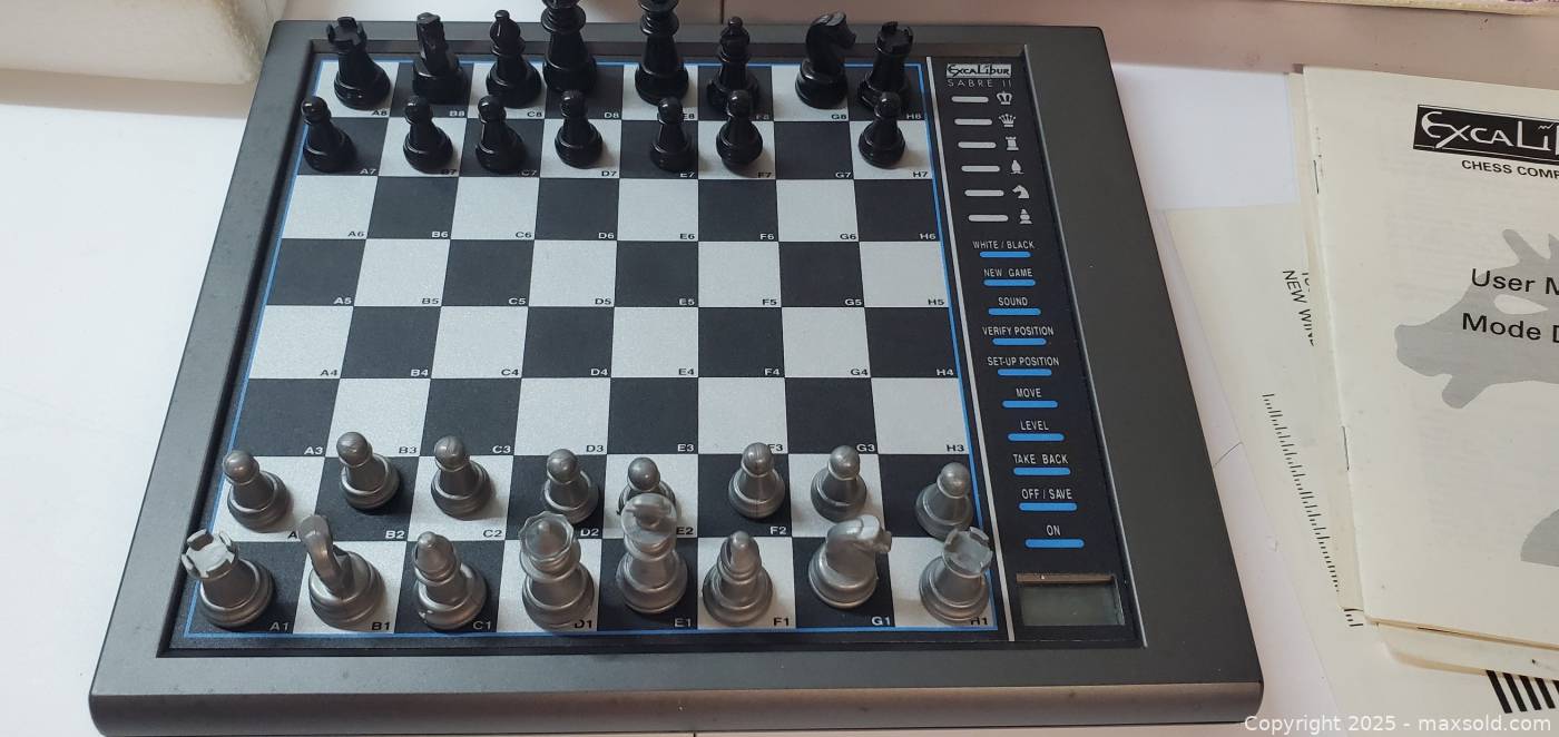 Excalibur electronic chess game with box, pieces, manuals | Maxsold