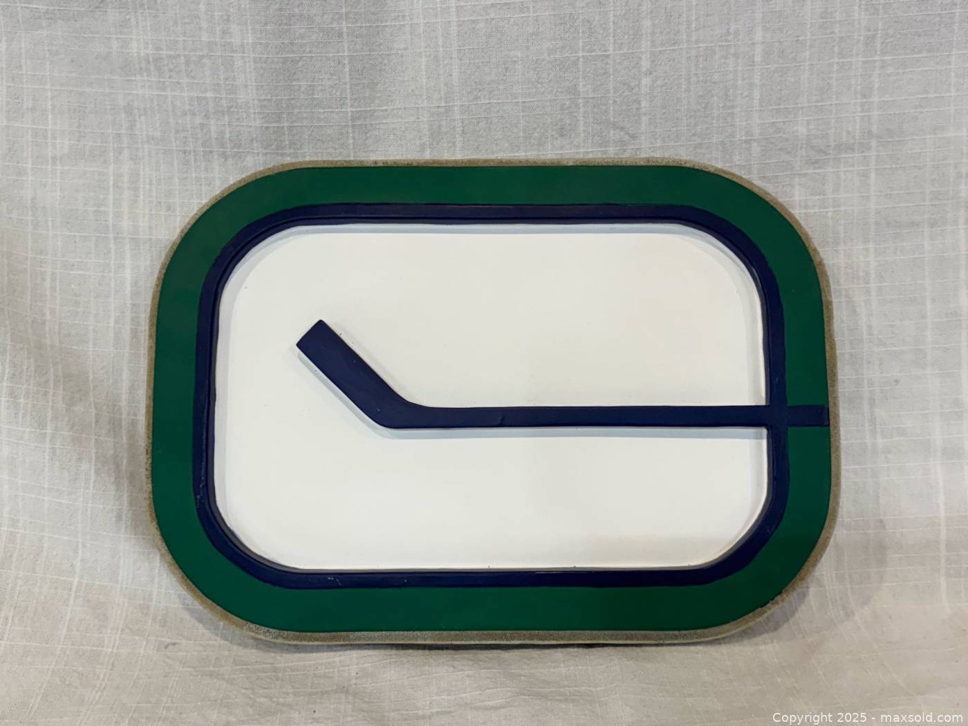 Vancouver Canucks Stick-in-Rink Logo Plaque | Maxsold