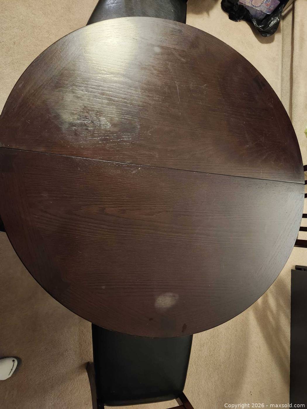 Wooden dining table with extension and 4 leather-seat chairs | Maxsold