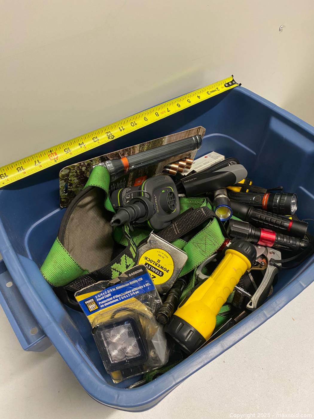 Bin of flashlights, air pump and assorted tools | Maxsold