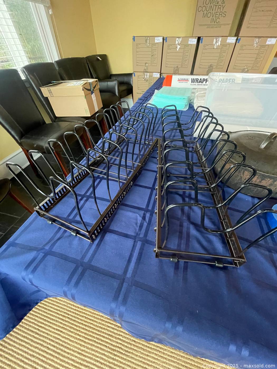 Lodge cast iron #8 pot with lid plus two black metal pan racks | Maxsold