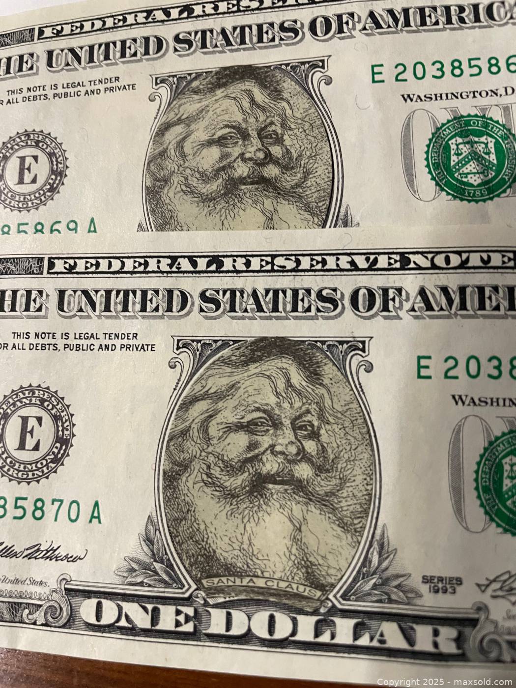 Santa Claus novelty one-dollar bills, 2 sequential with envelopes | Maxsold