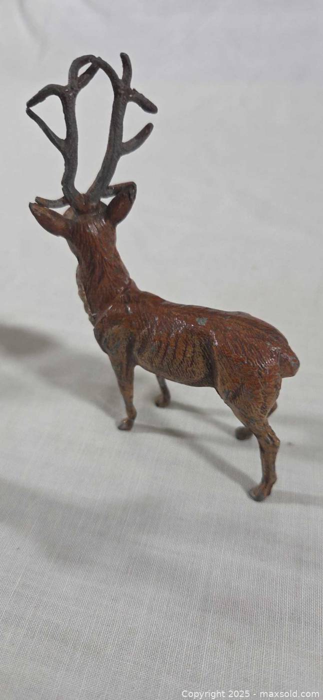 Four antique German metal reindeer figurines | Maxsold