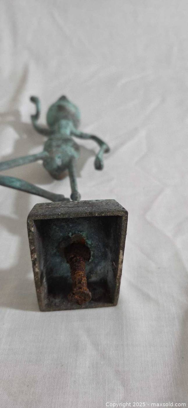 Three metal grasshopper sculptures | Maxsold