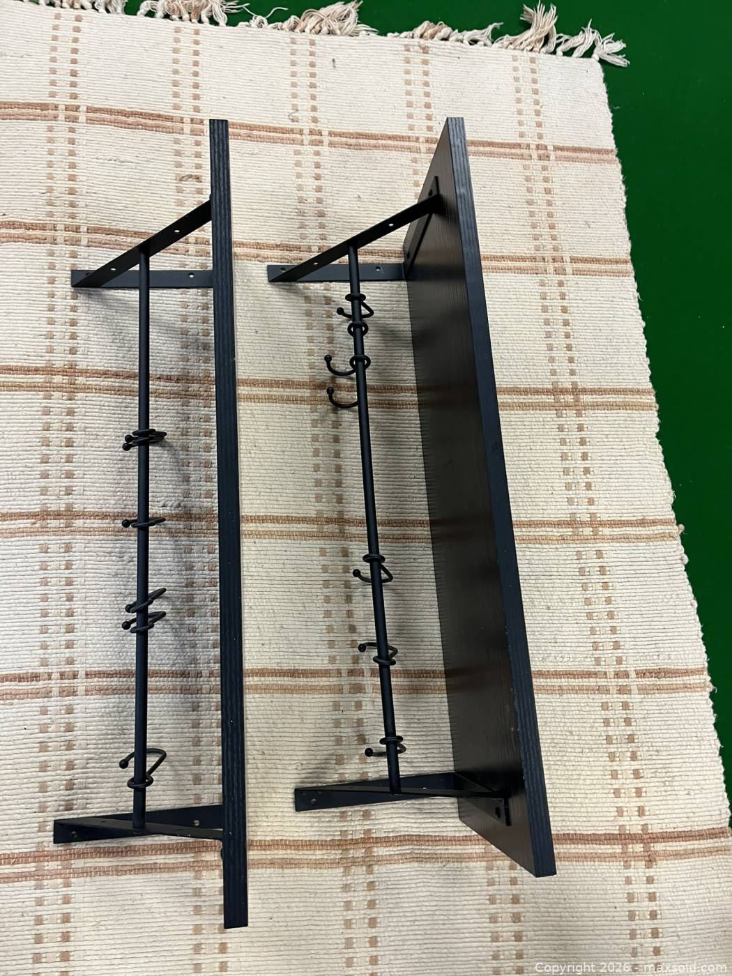 Pair of black wall mounted hook racks | Maxsold