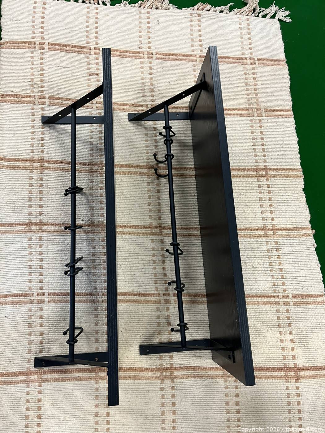 Pair of black wall mounted hook racks | Maxsold