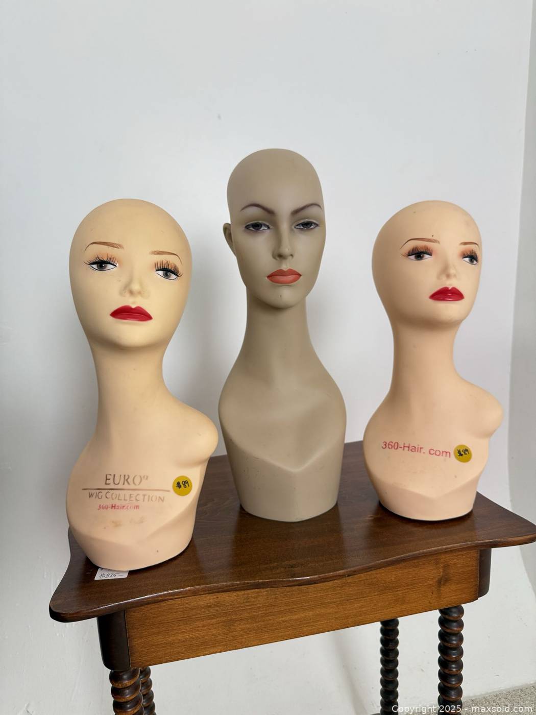 Three vintage mannequin display heads | Maxsold