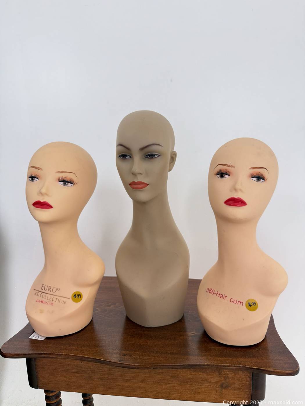 Three vintage mannequin display heads | Maxsold