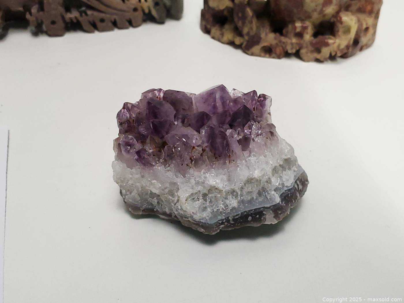 Carved soapstone sculptures and amethyst cluster | Maxsold
