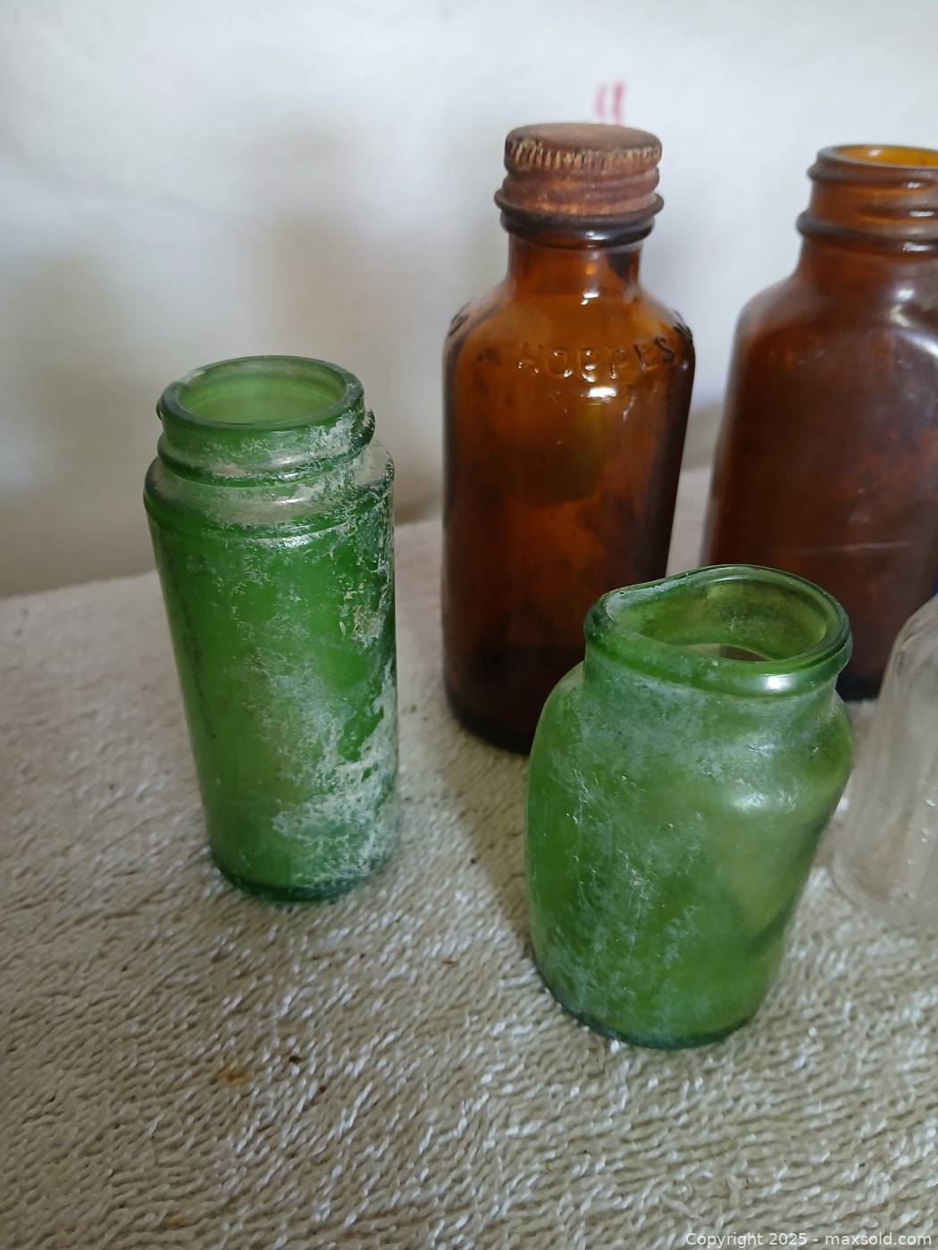Assorted collector glass bottles, 9 pcs | Maxsold