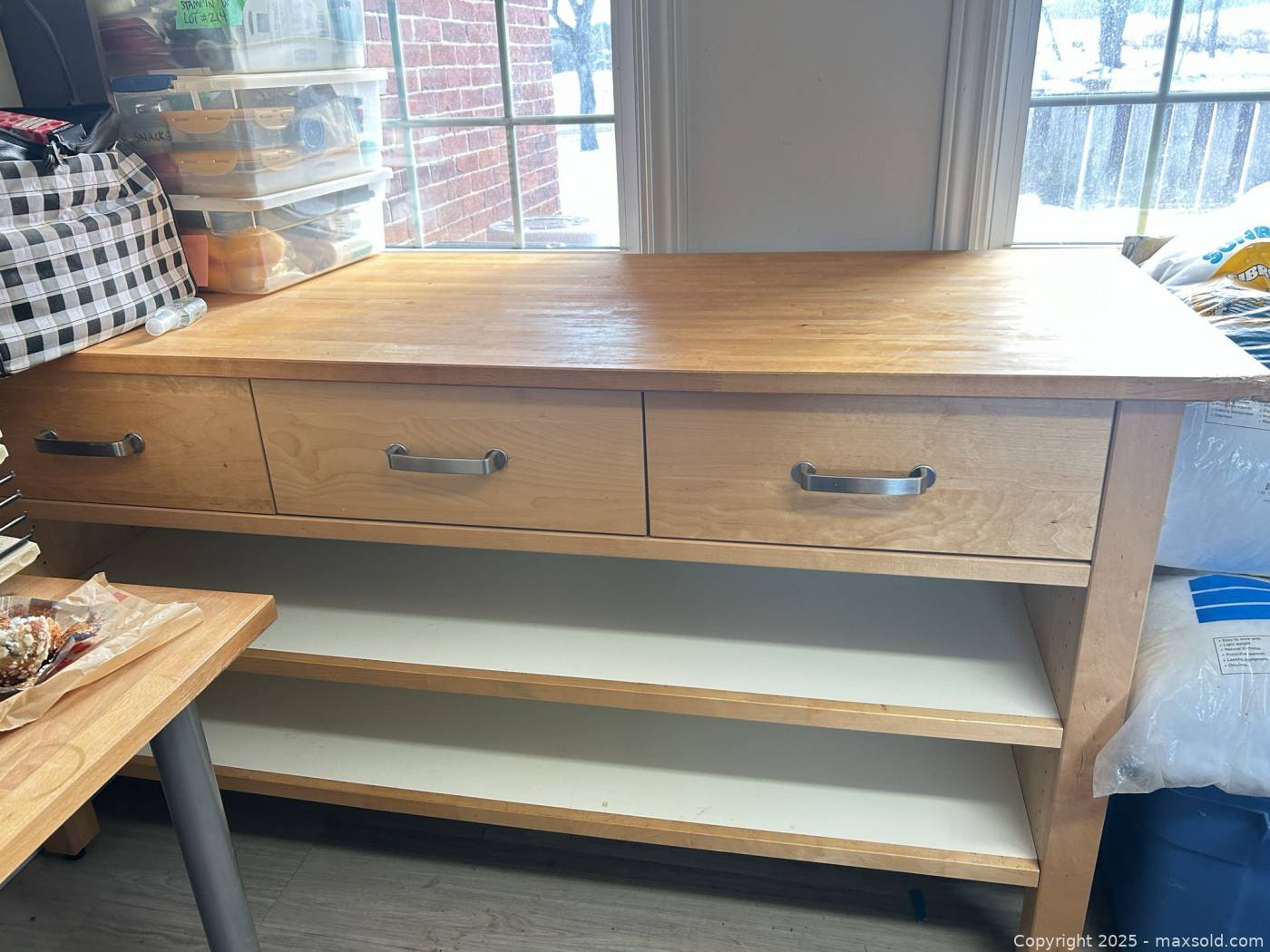 Butcher block kitchen island with drawers and shelves | Maxsold