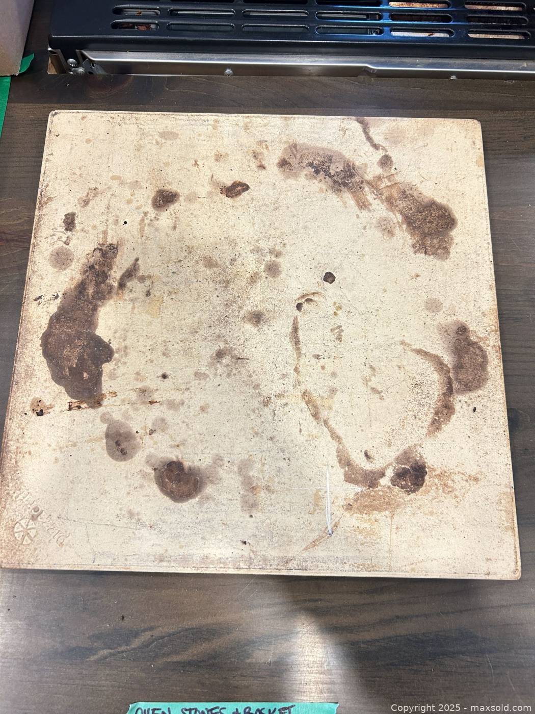 Ceramic pizza stones with mesh rack | Maxsold