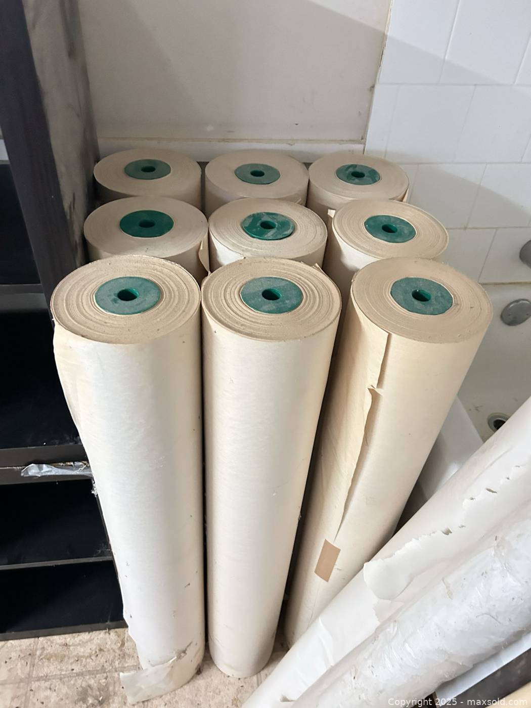 Large Off-White Paper Rolls With Green Plastic Cores | Maxsold