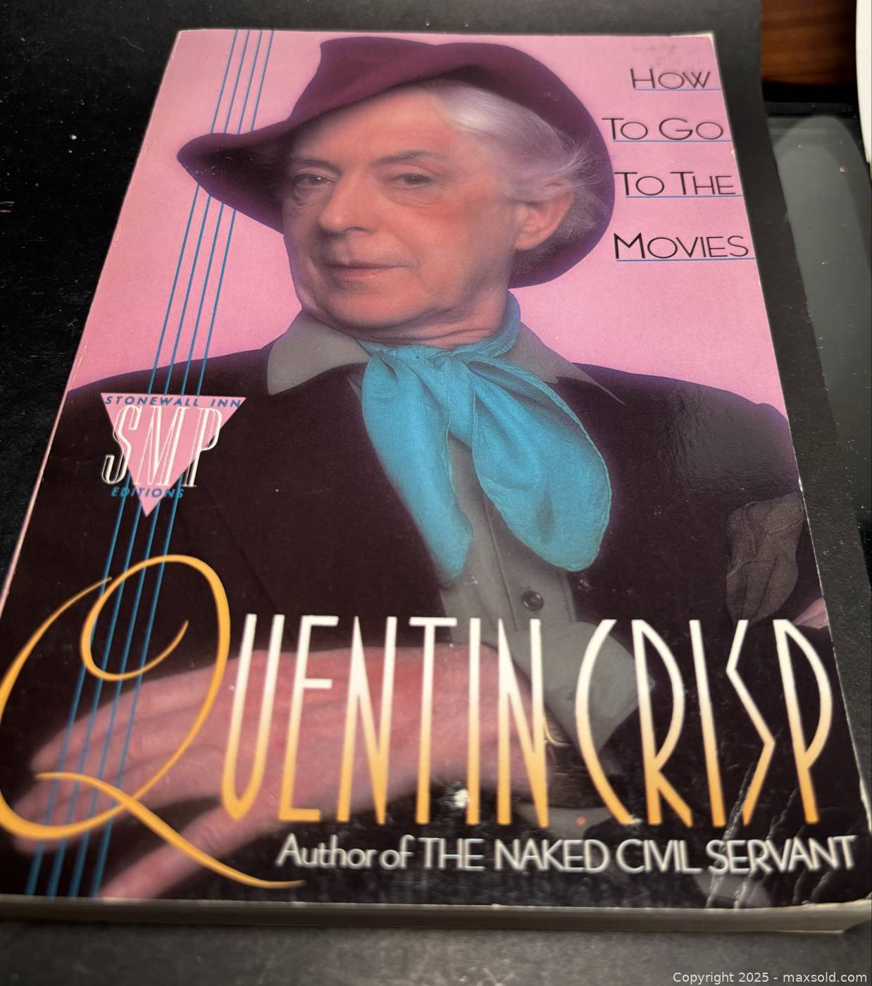 Signed Quentin Crisp “How to Go to the Movies” paperback | Maxsold