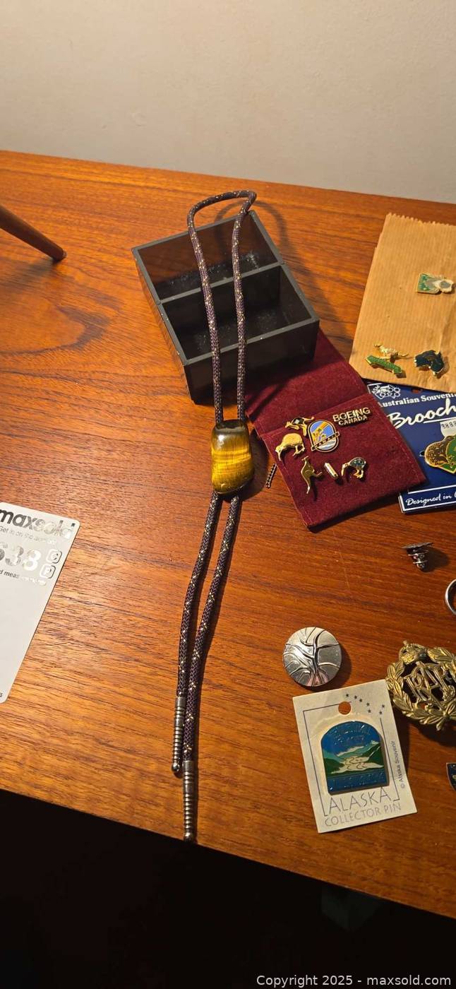 Assorted vintage lapel pins, tie tacks, cufflinks, keychains, bolo tie ...