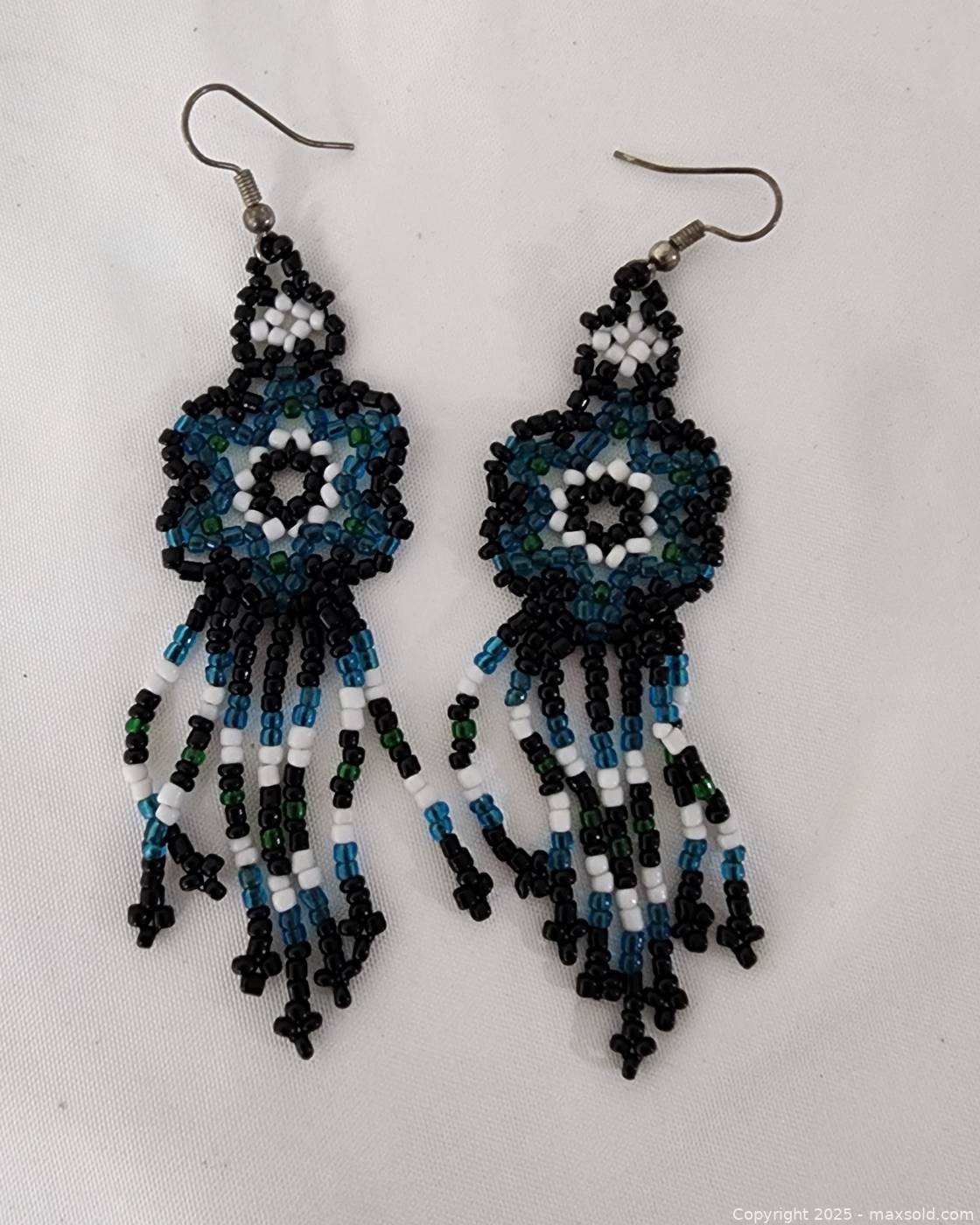 Beaded cuff strap and 5 pairs earrings | Maxsold