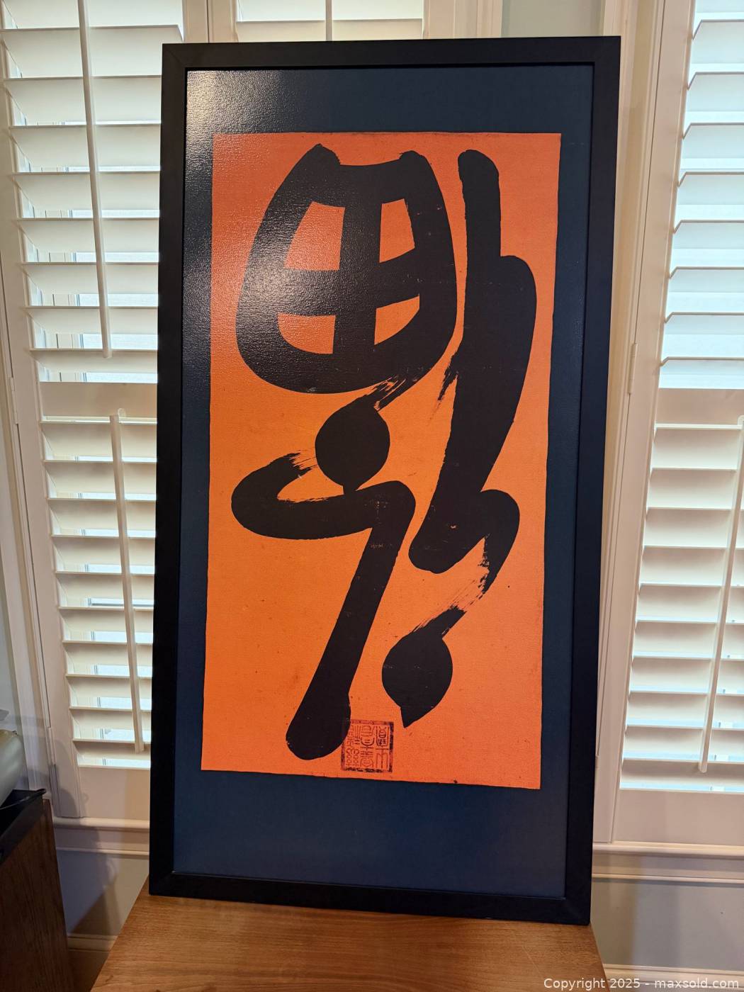 Framed Calligraphic Ink Artwork on Orange Paper | Maxsold