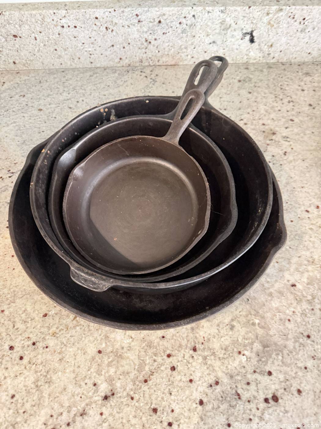 Nested cast iron skillets, four sizes | Maxsold