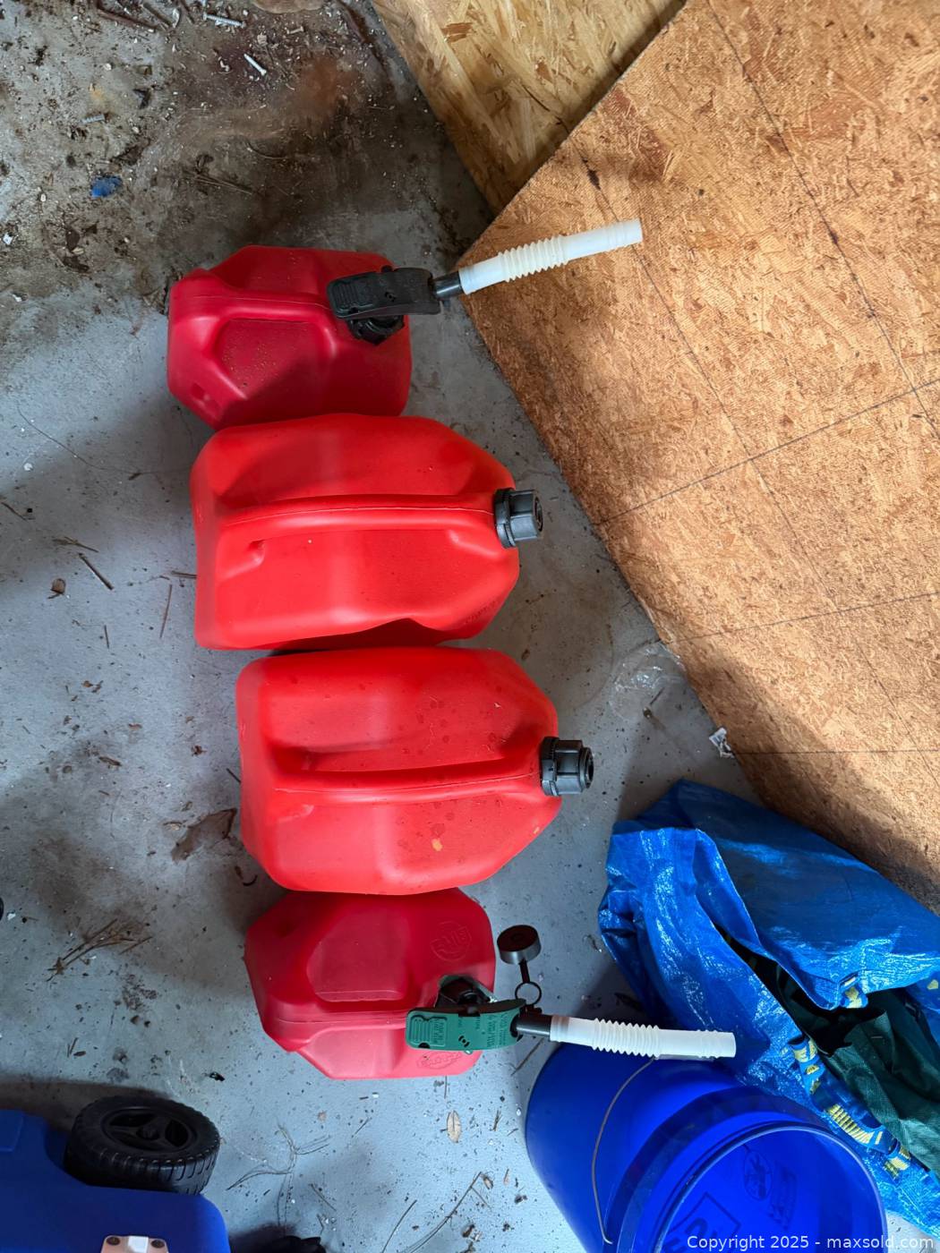 Four Red Plastic Fuel Gas Cans | Maxsold