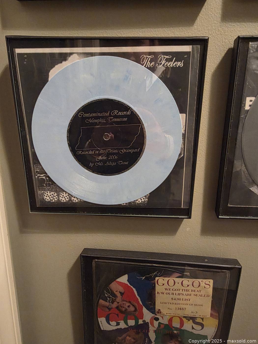 Framed display of 7" vinyl singles | Maxsold
