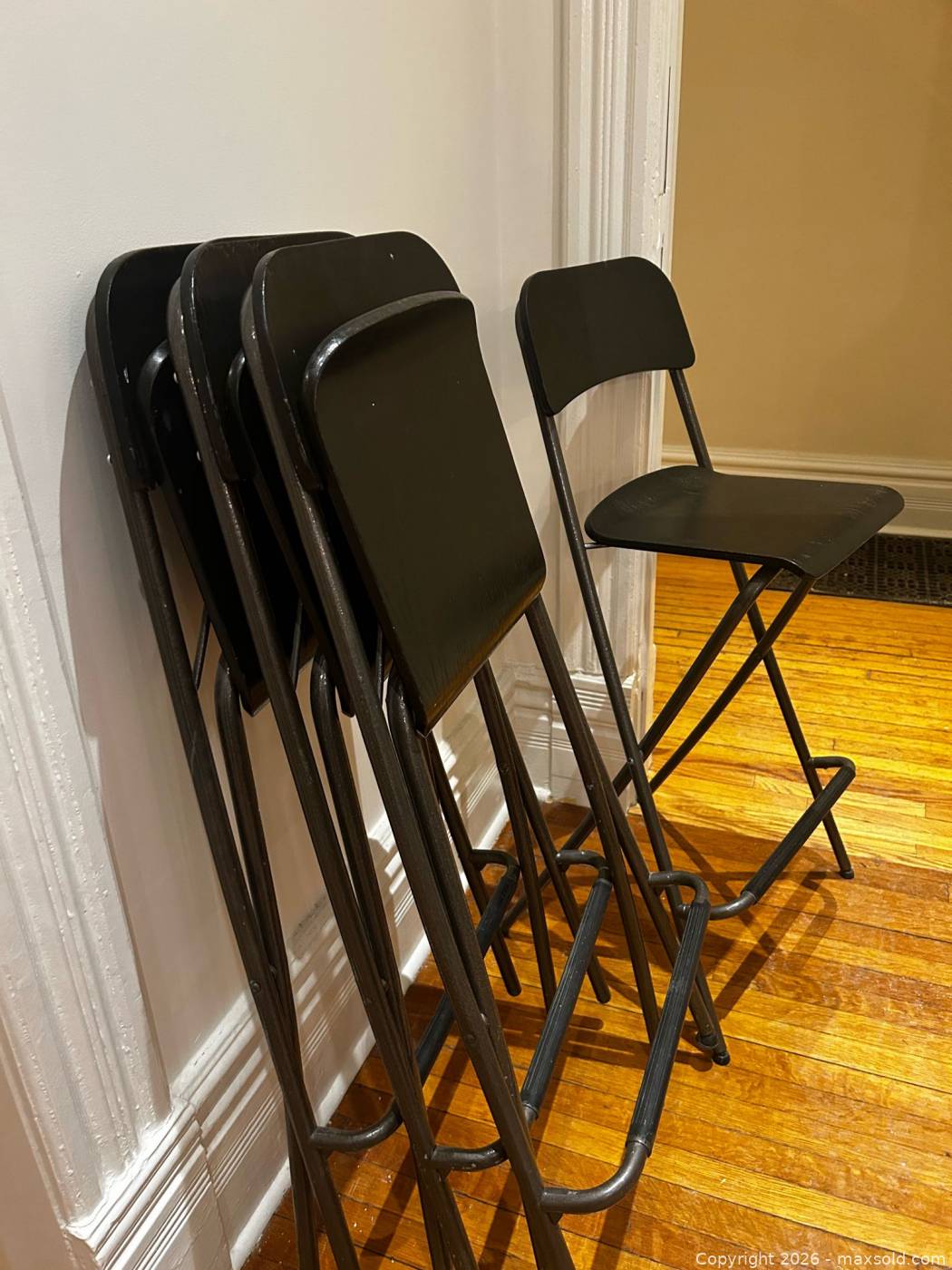 Four IKEA Franklin black metal bar stools | Maxsold