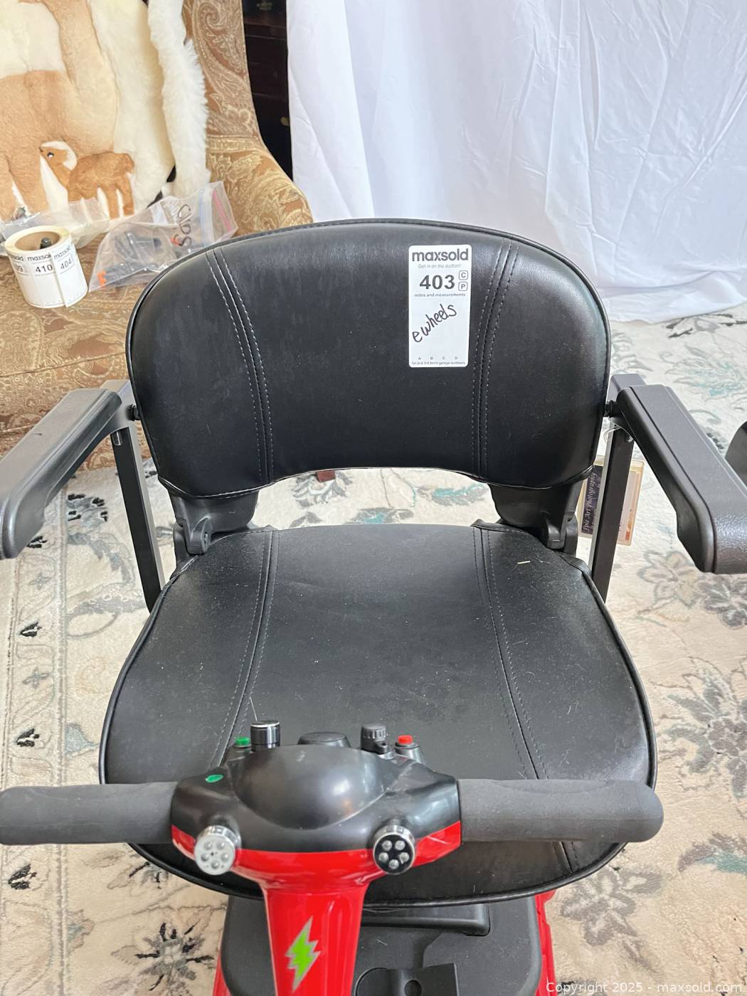 eWheels red mobility power scooter with accessories | Maxsold