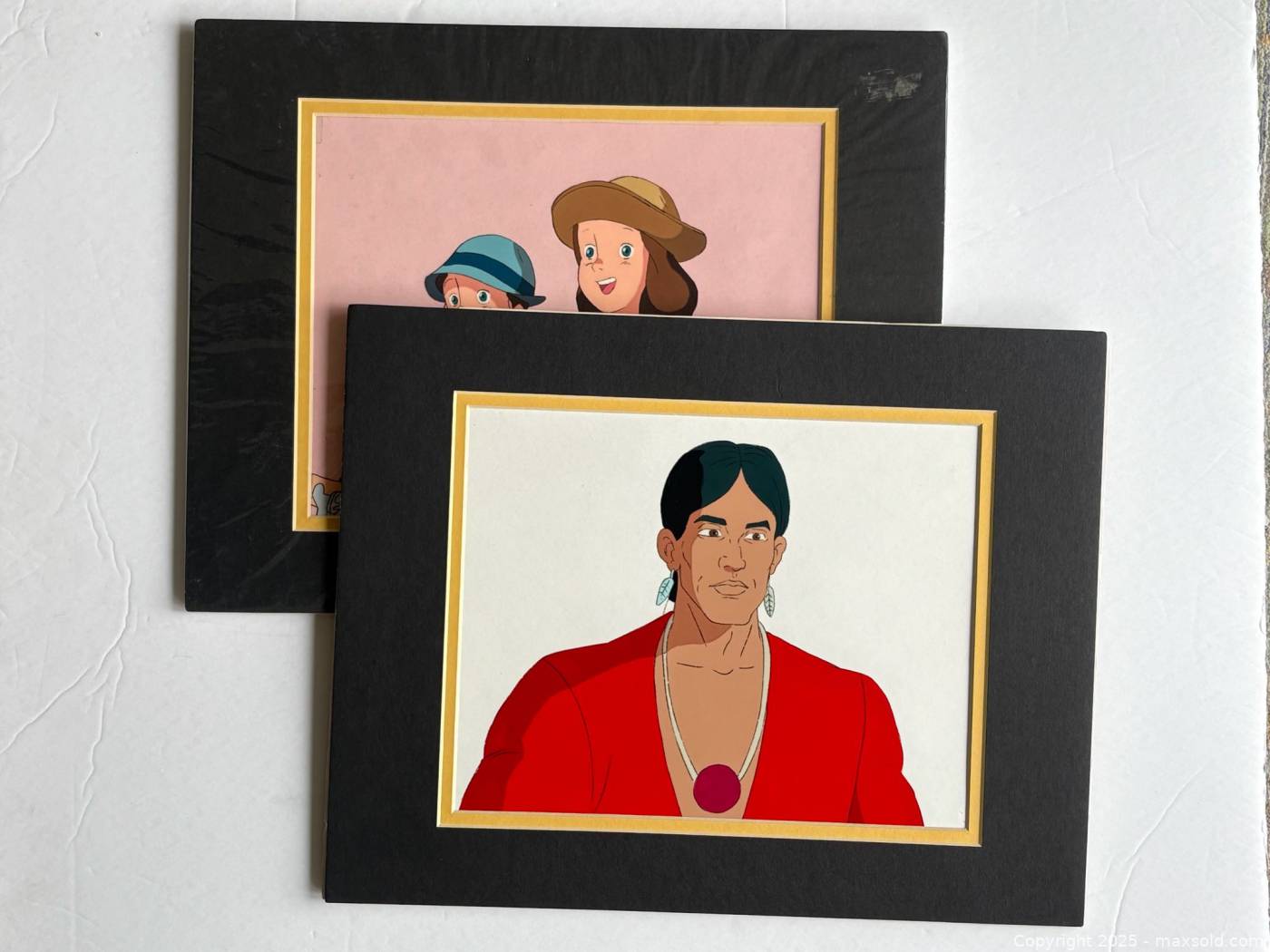 Two original animation cels, matted | Maxsold