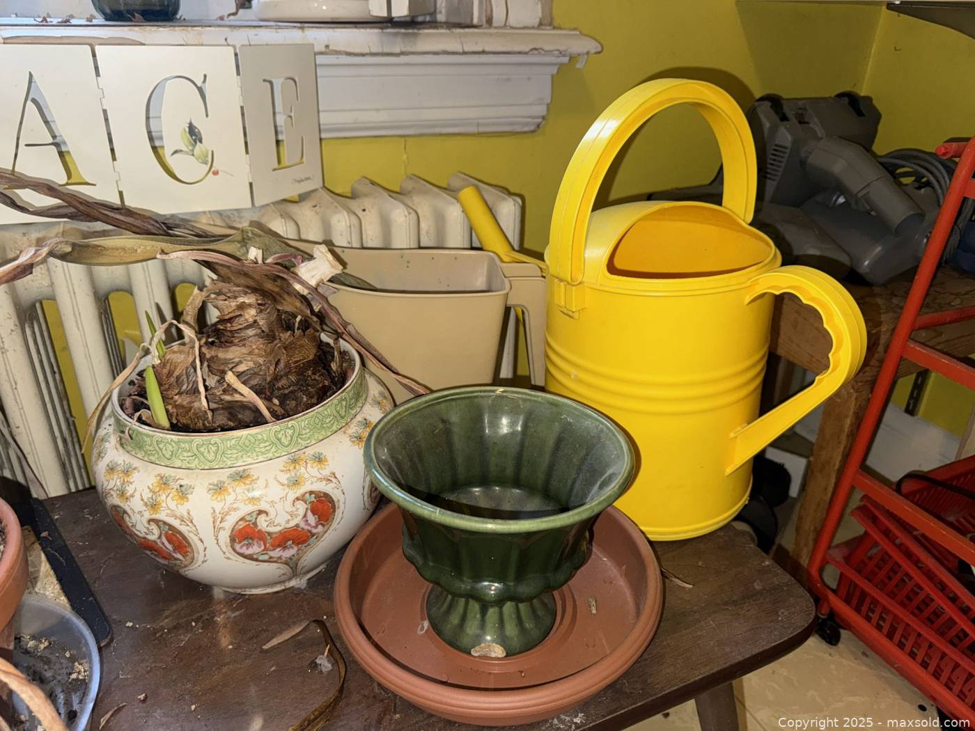 Assorted plant pots, planters, watering cans and table | Maxsold