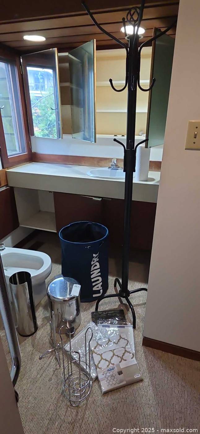 Coat rack, hamper, trash can, umbrella holder, mats | Maxsold