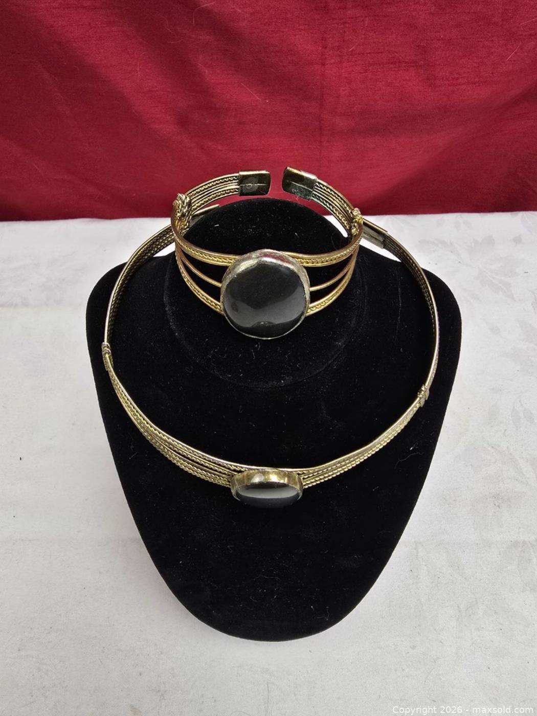 Gold-tone choker necklace and cuff bracelet with black cabochons | Maxsold