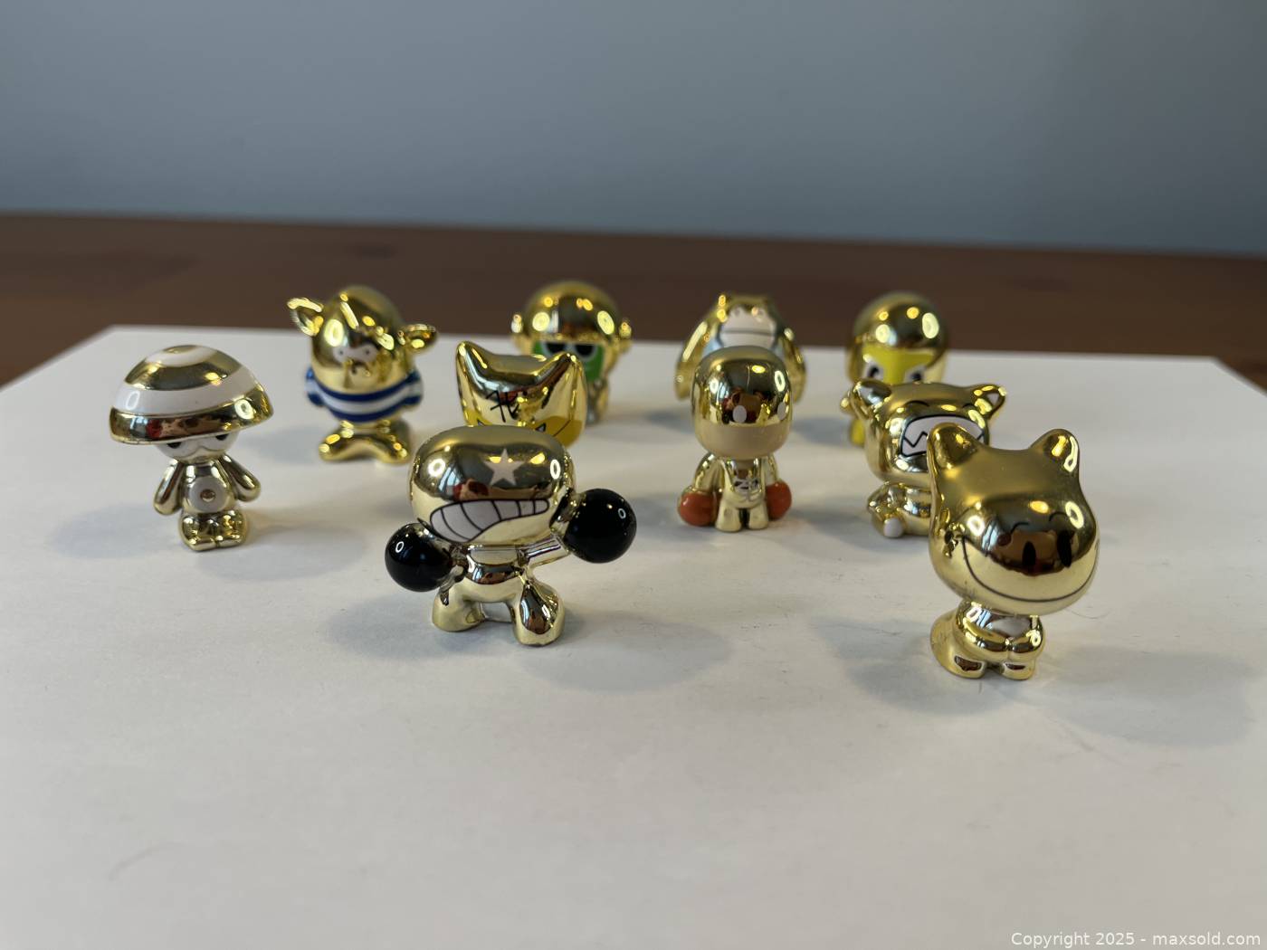 Gogo’s Crazy Bones gold figurines set of 10 | Maxsold