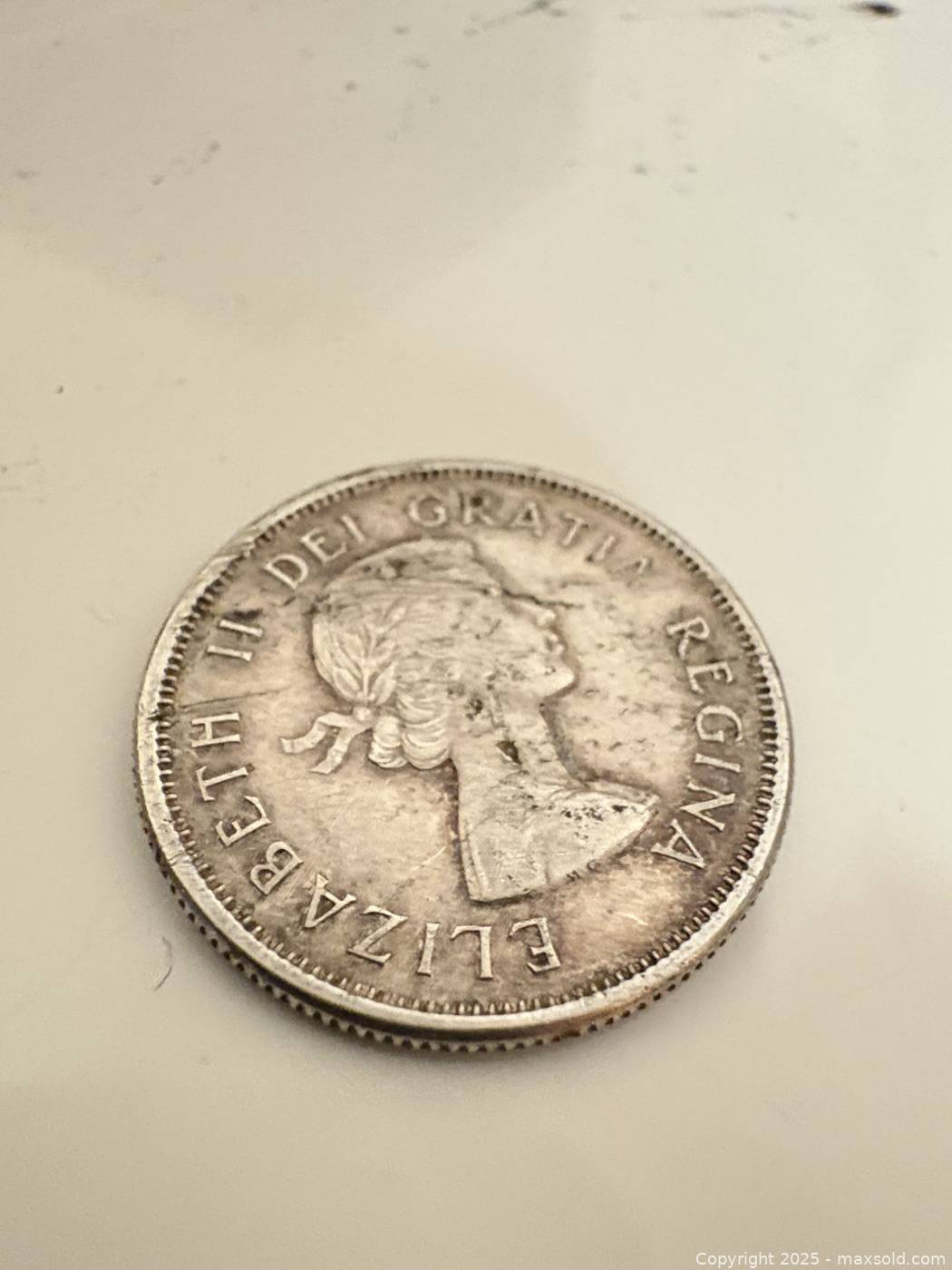 1964 Canadian silver quarter | Maxsold