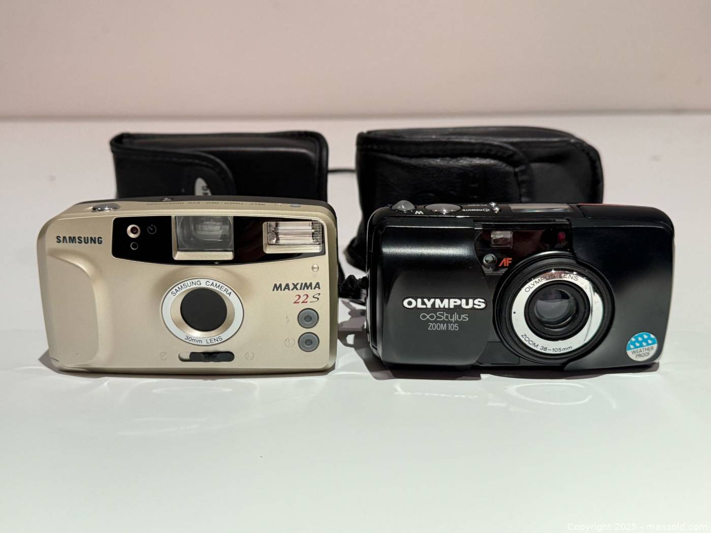 Olympus and Samsung 35mm point-and-shoot cameras | Maxsold