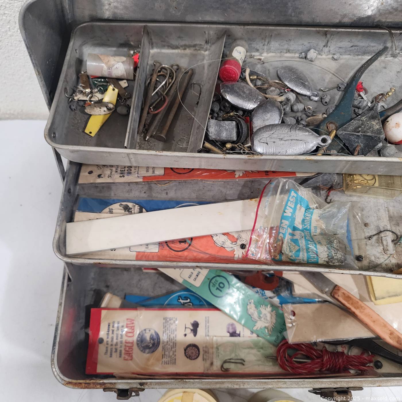 Metal tackle box with assorted fishing gear | Maxsold