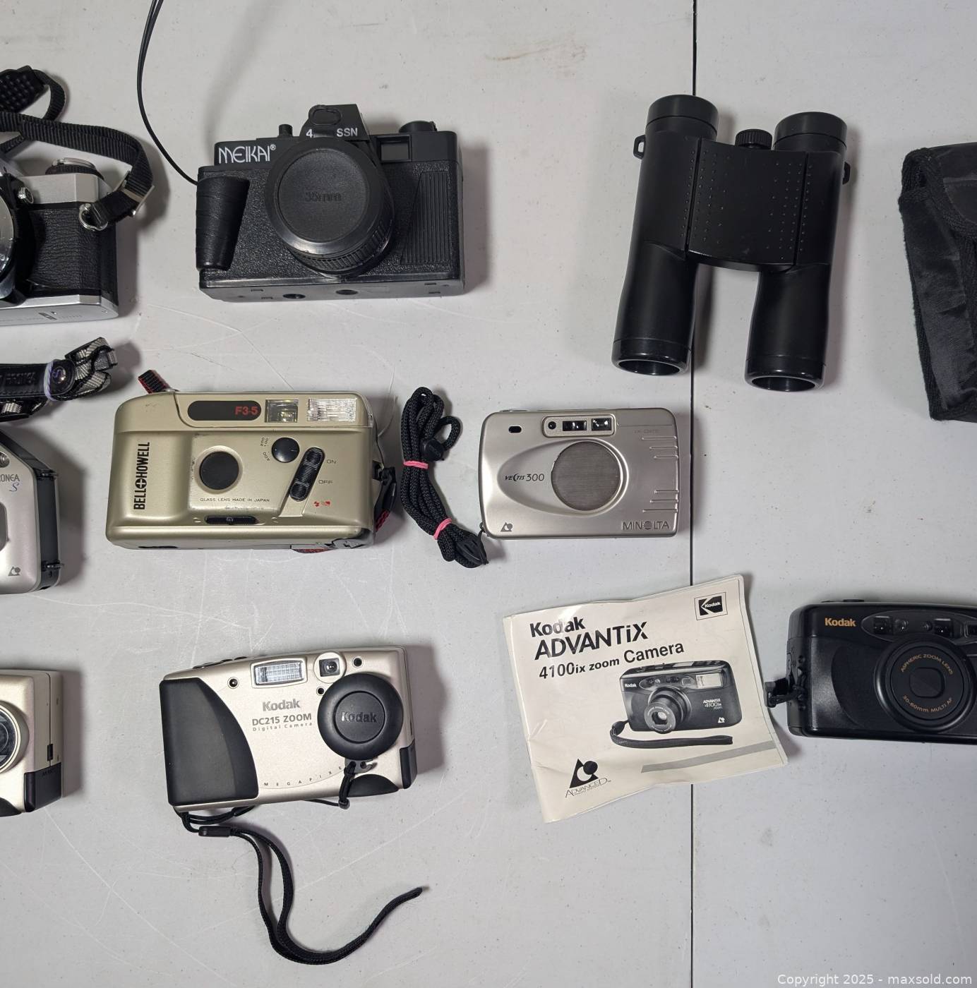 Olympus OM-Series, Meikai & Kodak Cameras, Binoculars, Flashes | Maxsold