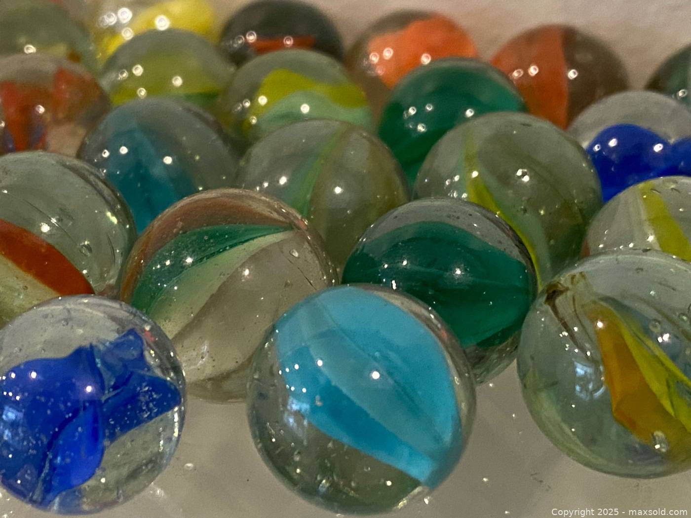 Vintage small glass marbles | Maxsold
