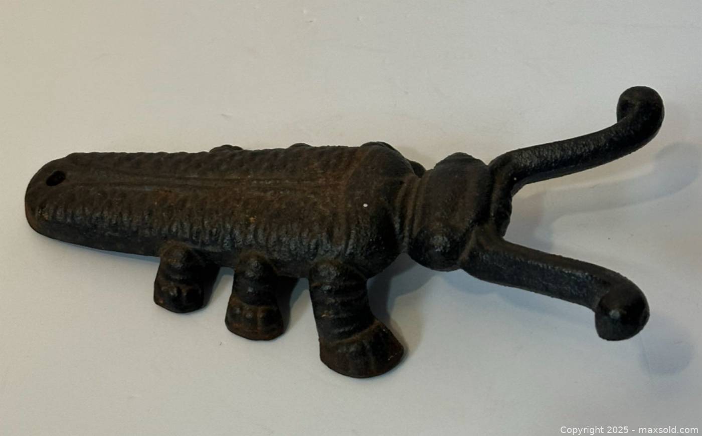Cast iron beetle boot jack door stop | Maxsold