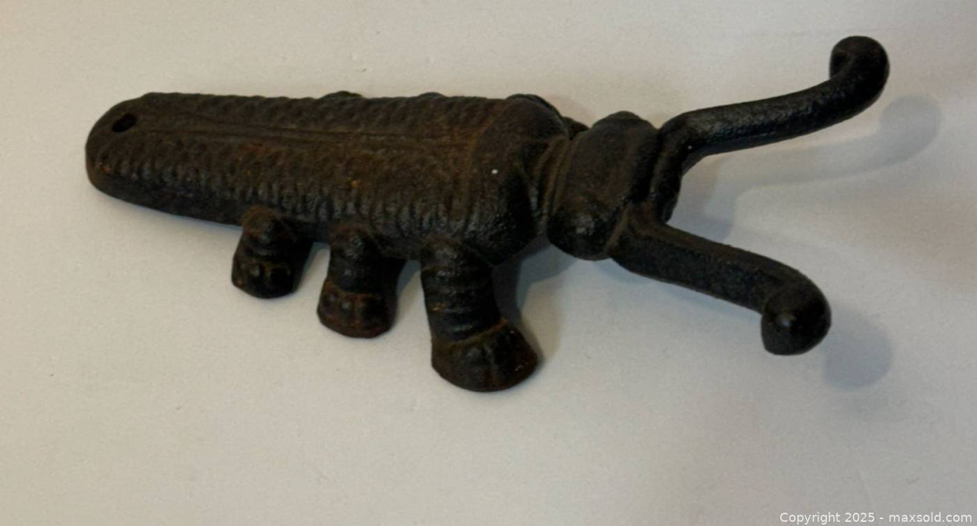 Cast iron beetle boot jack door stop | Maxsold