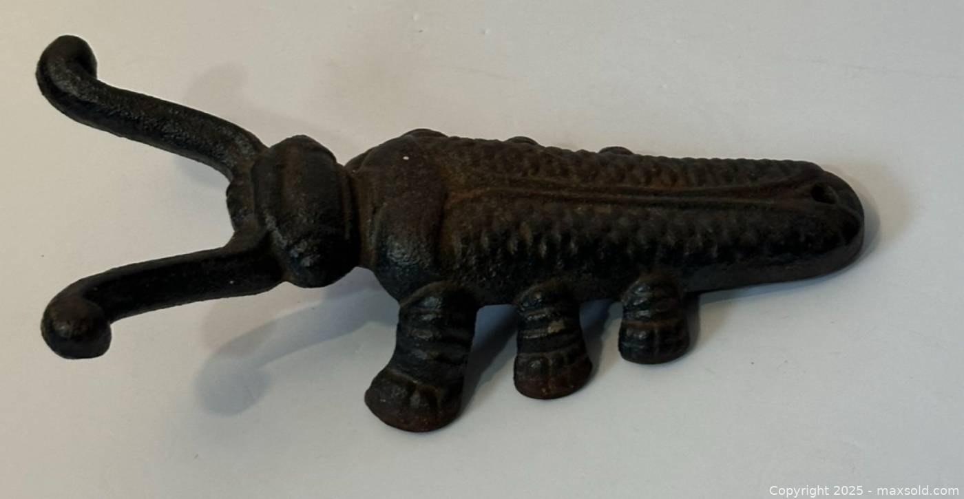 Cast iron beetle boot jack door stop | Maxsold