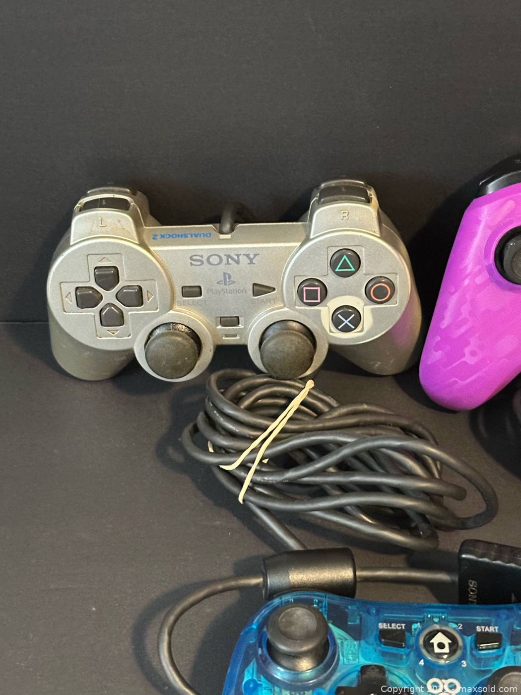 Sony DualShock 2, Biogenik and Nintendo Switch wired controllers | Maxsold