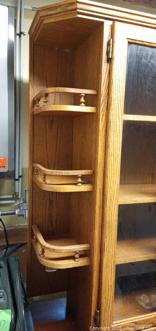 Oak wall-mount kitchen cabinet with glass doors | Maxsold