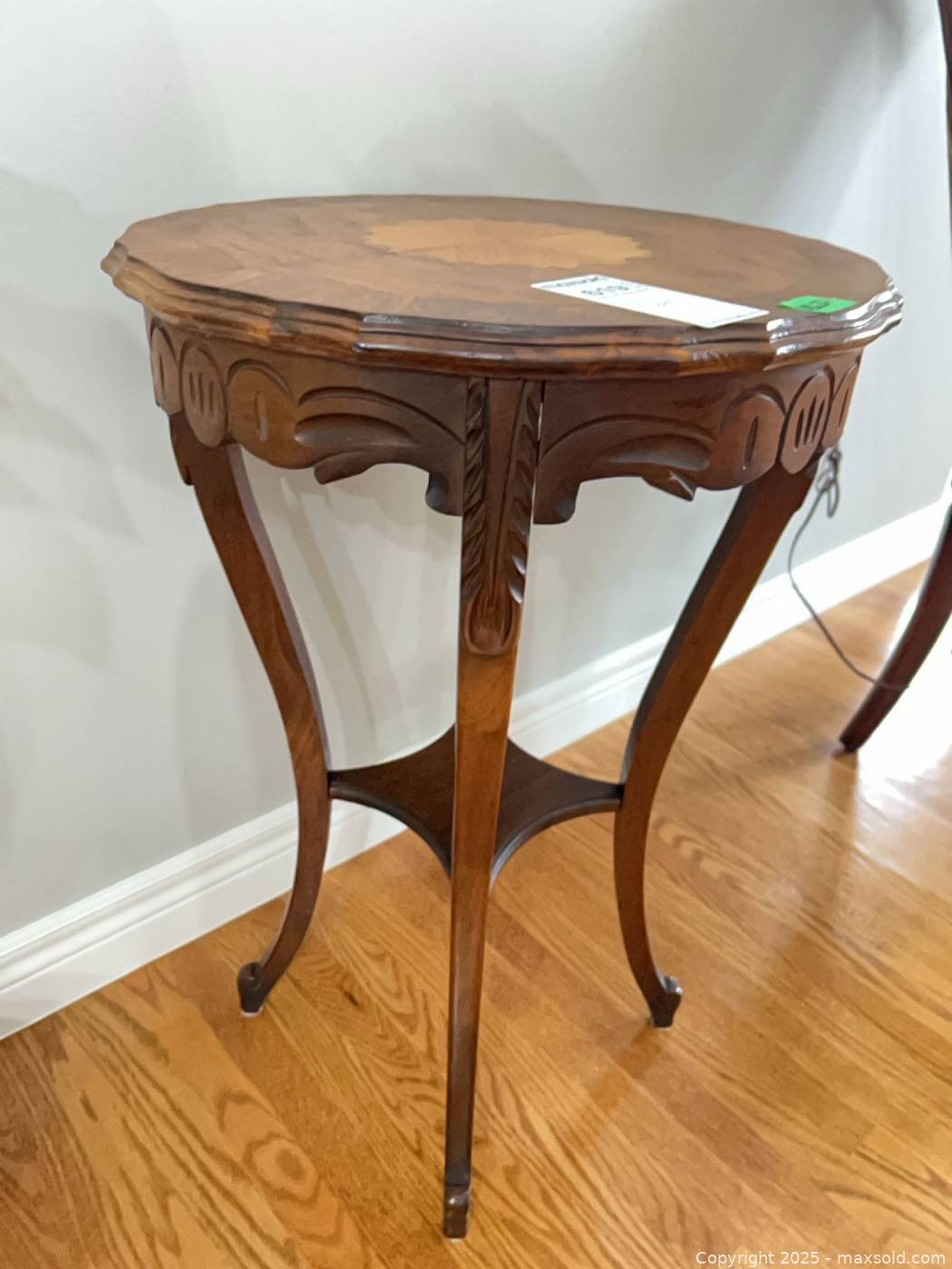 Round carved wooden side table | Maxsold