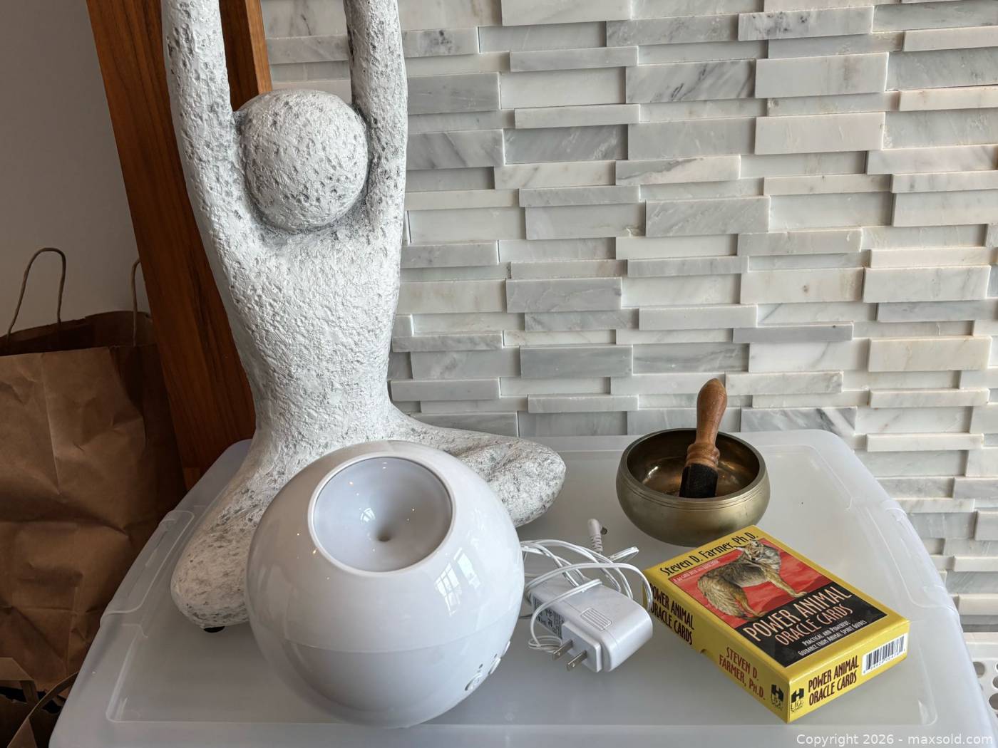Singing bowl, diffuser, statue, oracle cards | Maxsold